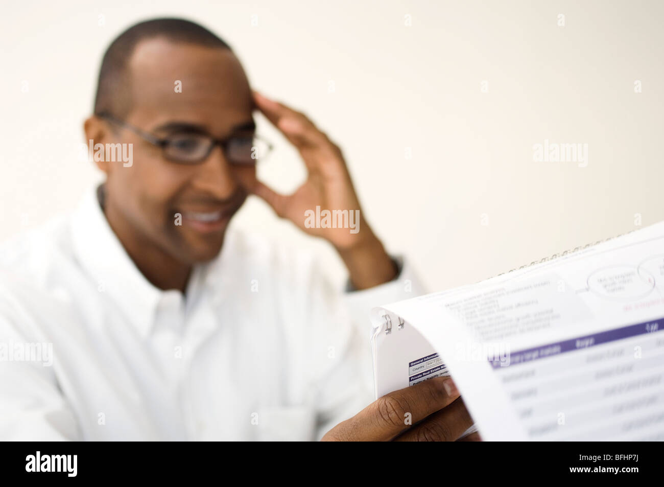 Man Reading a Document Stock Photo - Alamy