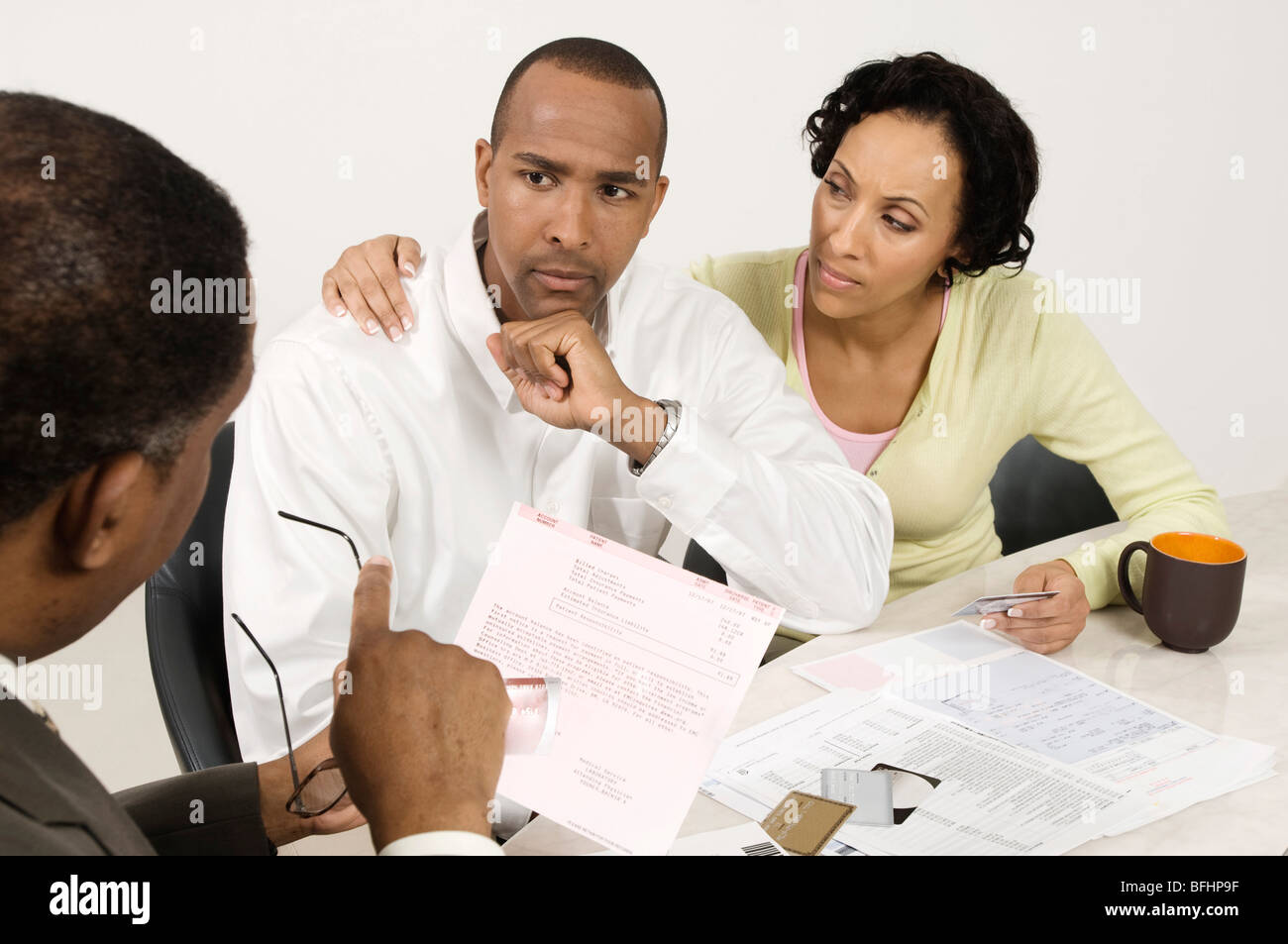 Couple Talking with Accountant Stock Photo - Alamy