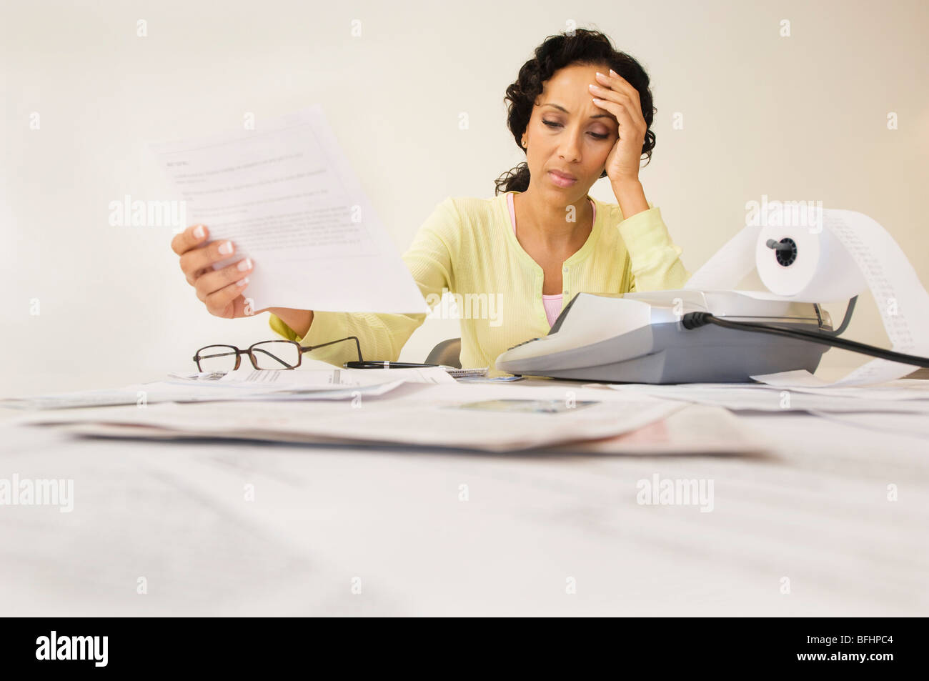 Woman Working on Bills Stock Photo - Alamy