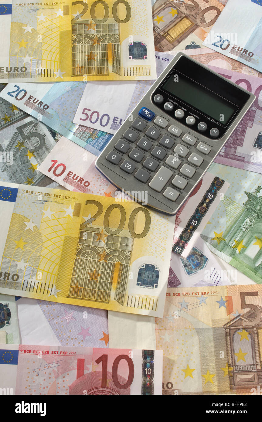 Money and Calculator Stock Photo - Alamy