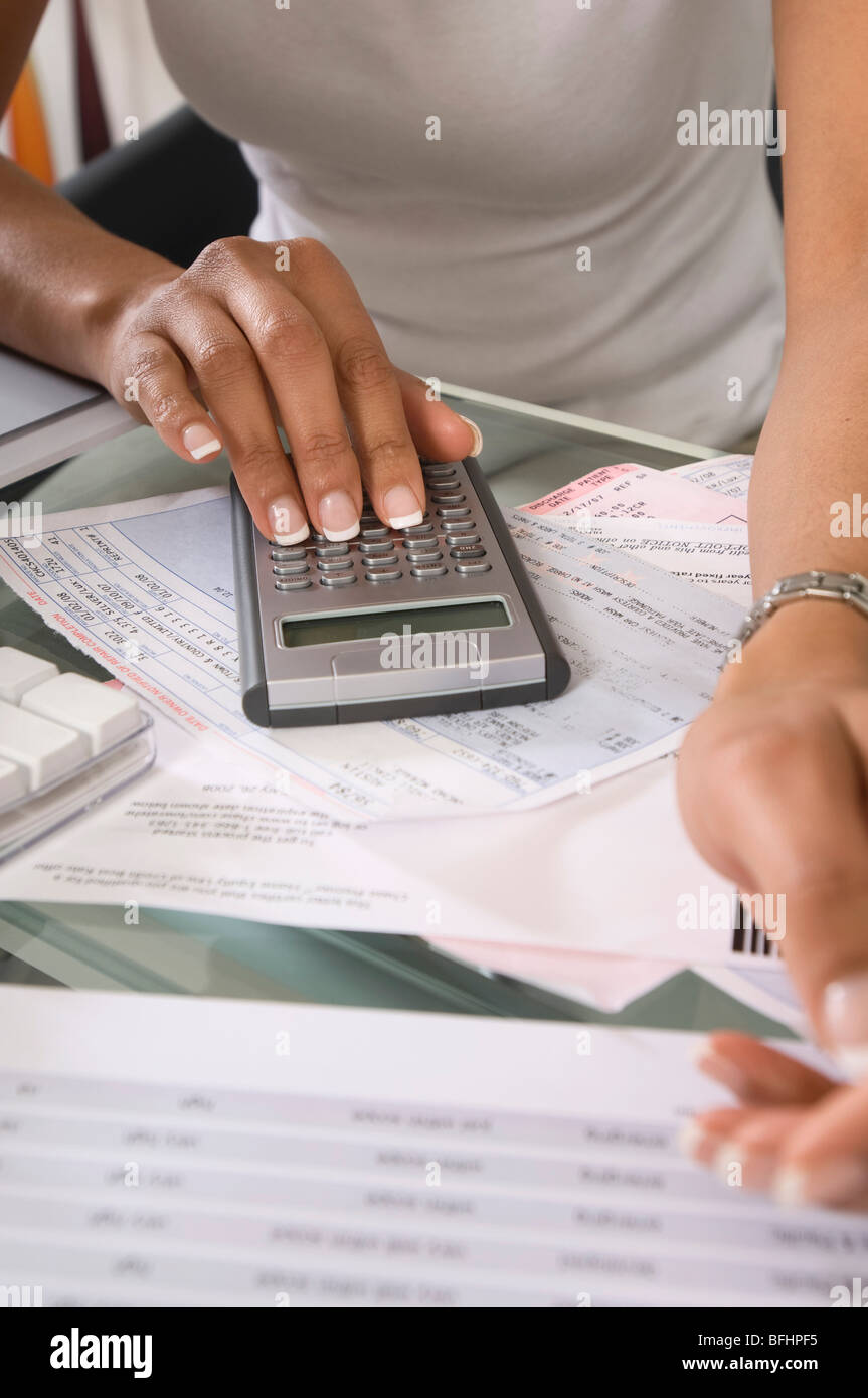 Woman Calculating Bills Stock Photo - Alamy