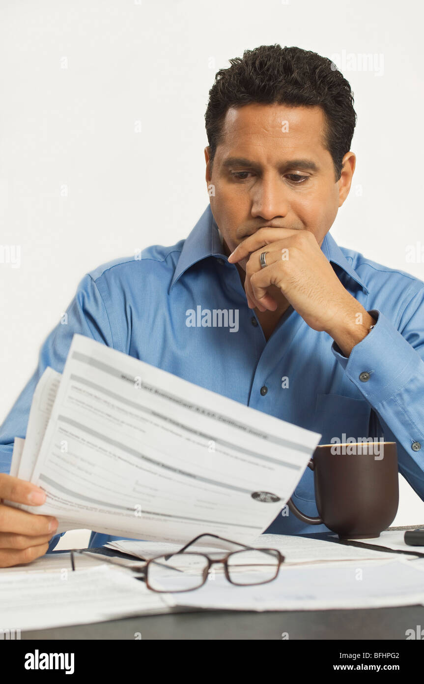 Man Reading a Tax Form Stock Photo - Alamy