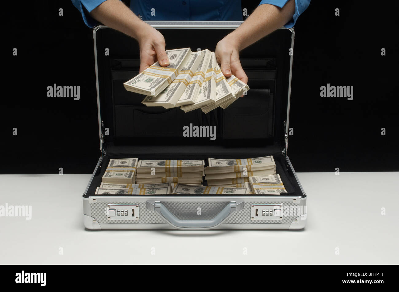 Briefcase Full of Money Stock Photo - Alamy