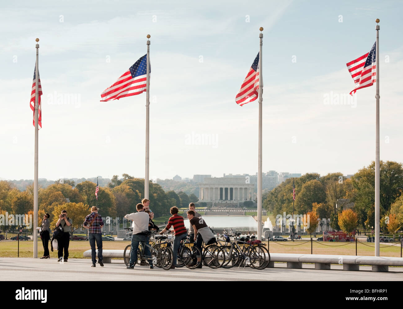 Teenagers and their bicycles at the Washington Monument looking back ...