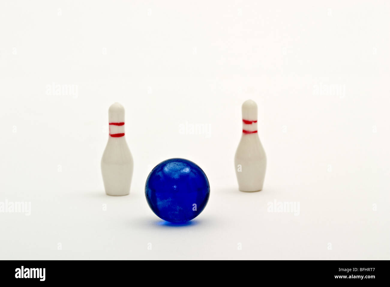 Small toy bowling ball heading for a seven ten split Stock Photo - Alamy