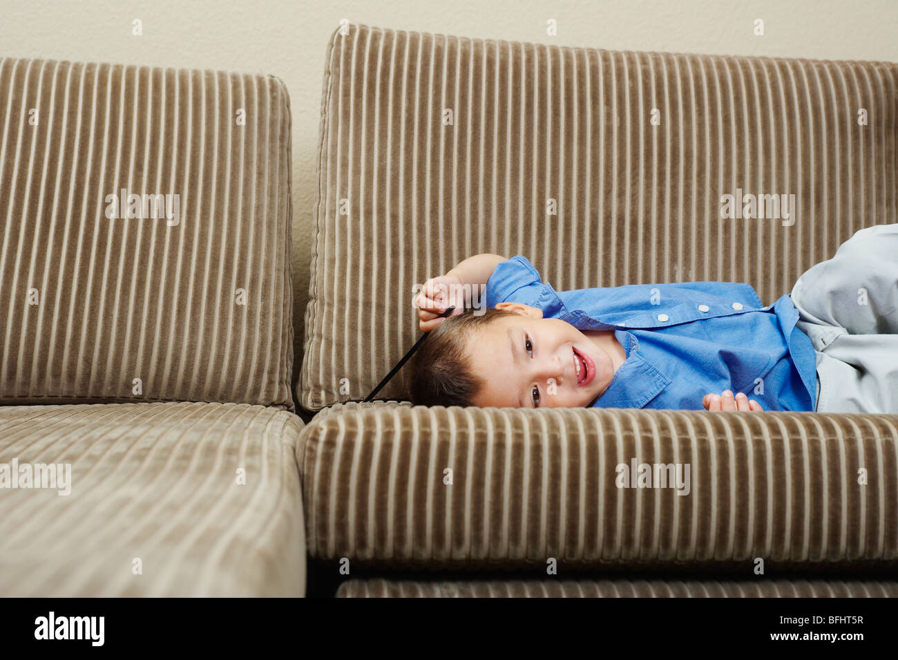 Teen boy relaxing sofa hi-res stock photography and images - Alamy