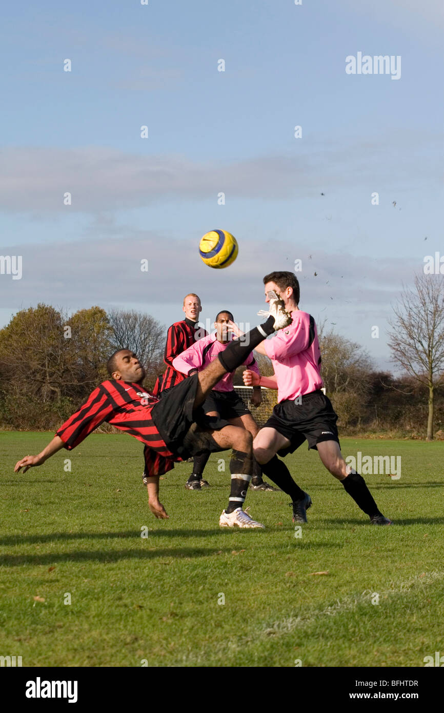 Sport football tackling action kicking ball hi-res stock photography ...