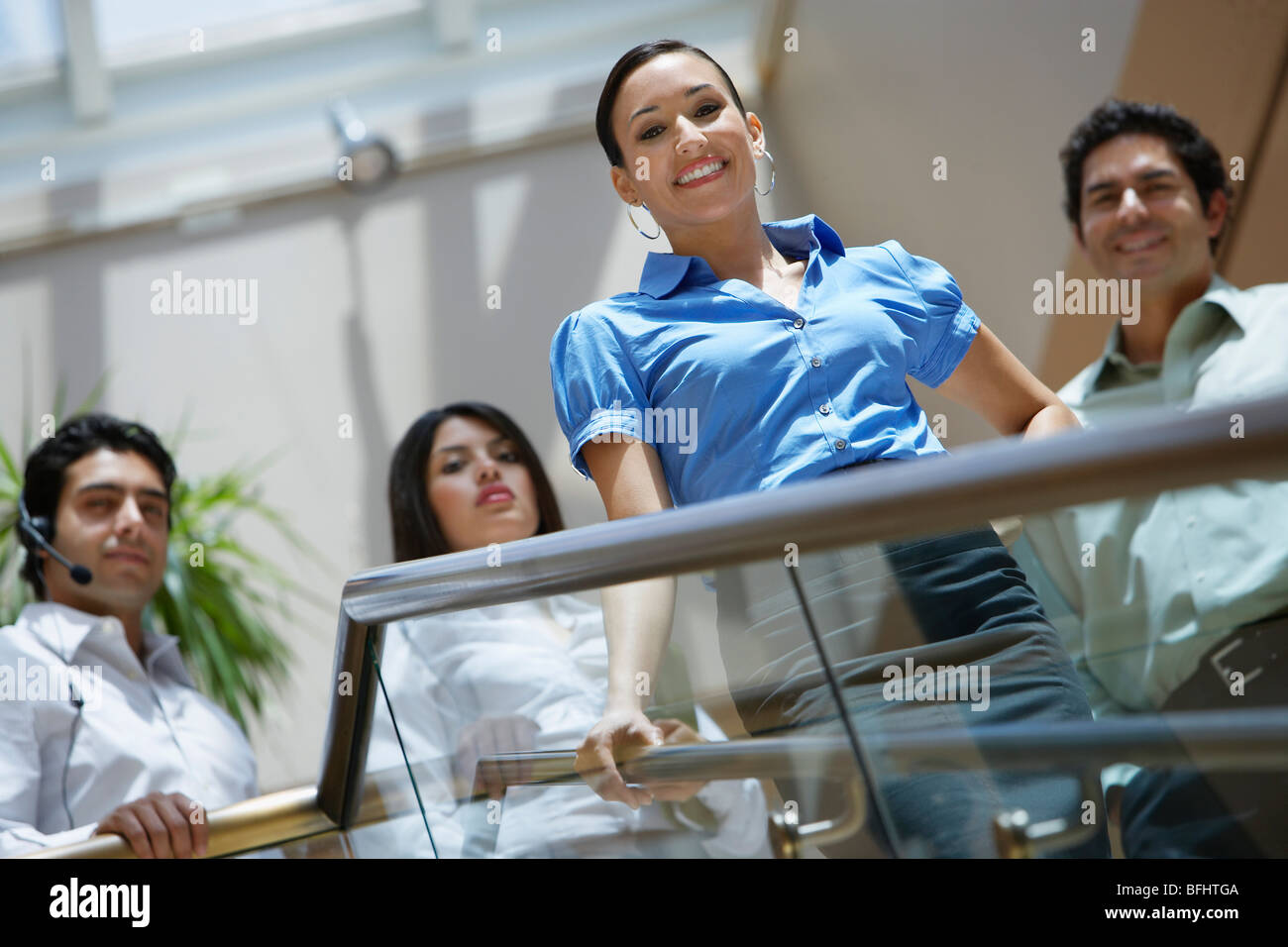 Business colleagues standing on stairs Stock Photo - Alamy
