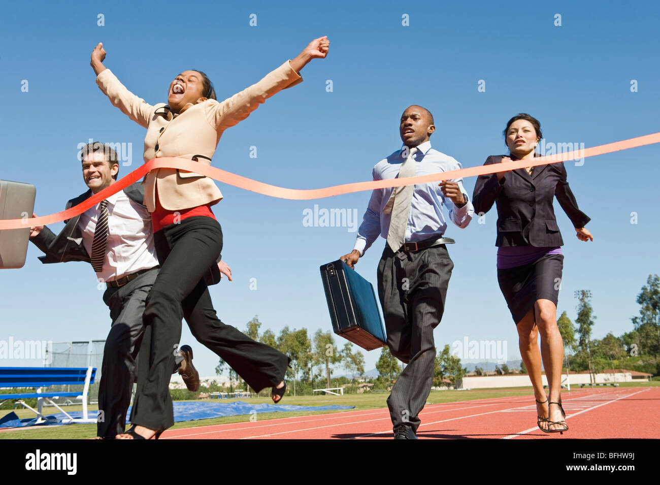 Business People Crossing the Winning Line Stock Photo - Alamy