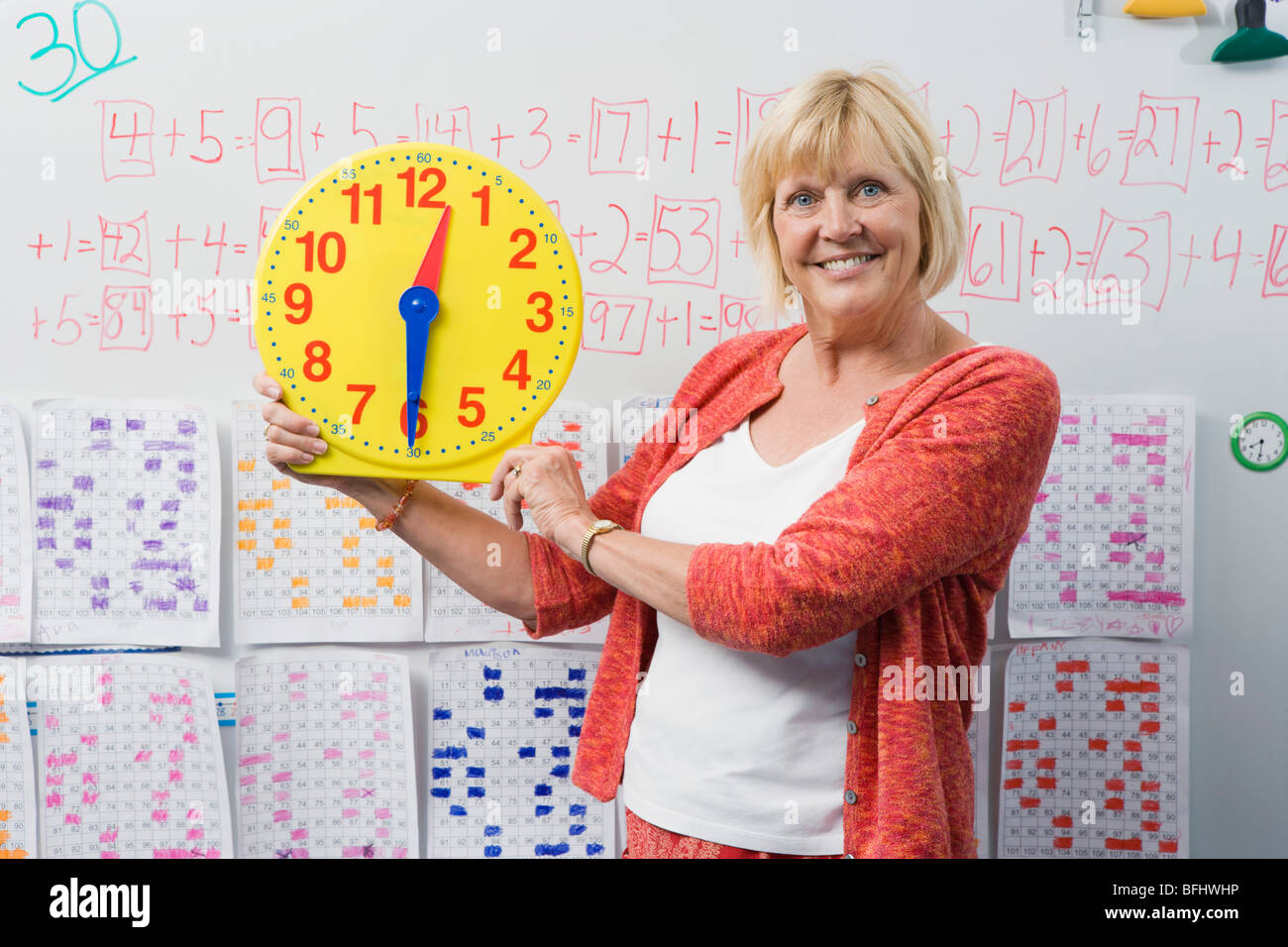Teacher Showing Class a Clock Stock Photo - Alamy