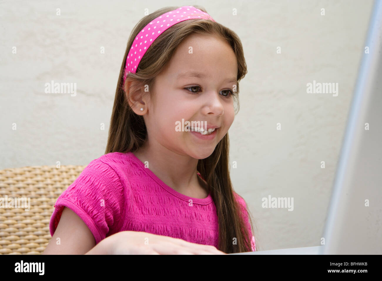 Little Girl Using a Laptop Stock Photo - Alamy