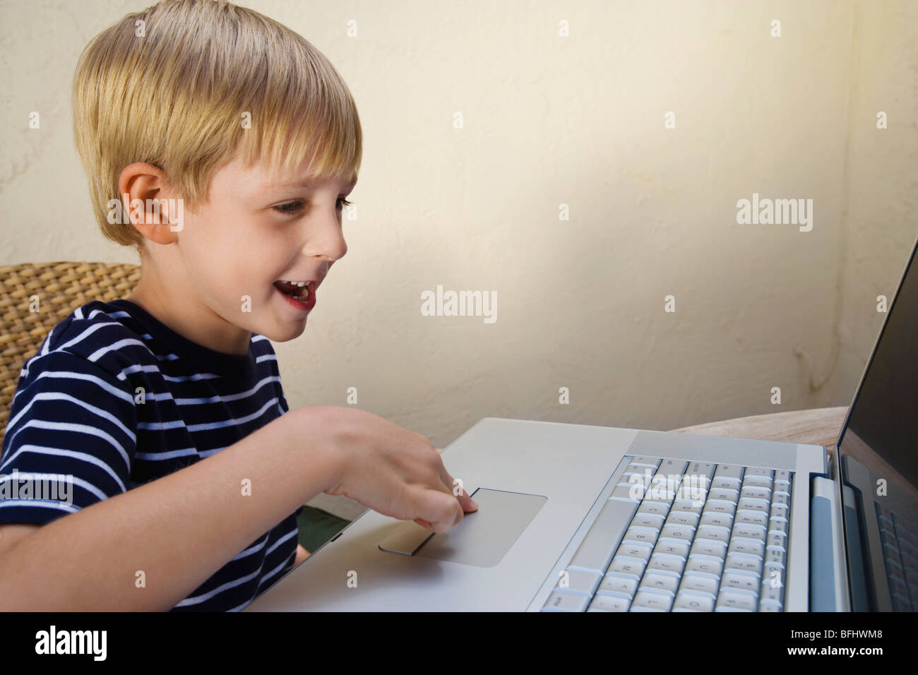 Little Boy Using a Laptop Stock Photo - Alamy
