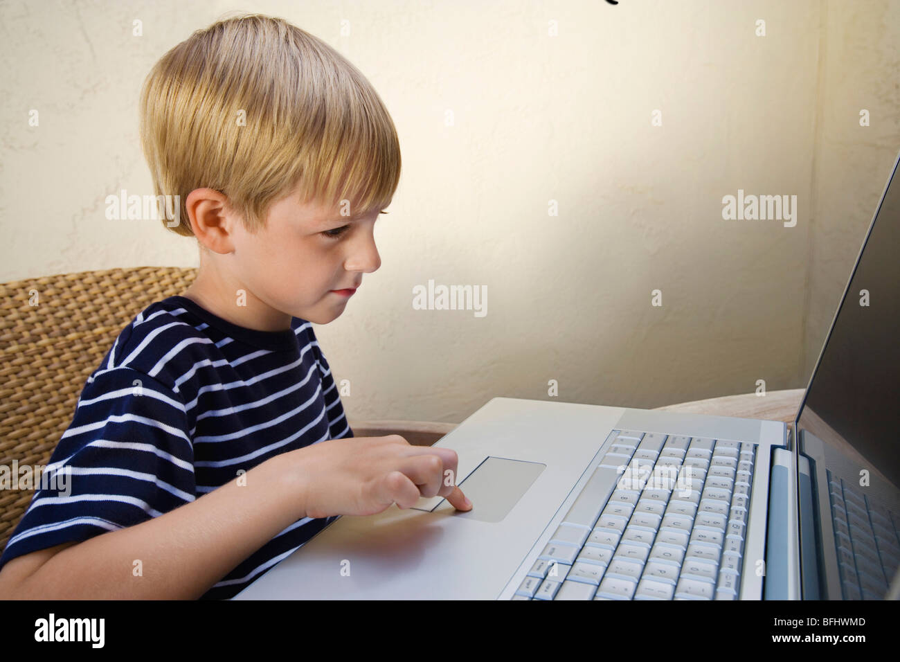 Little Boy Using a Laptop Stock Photo - Alamy