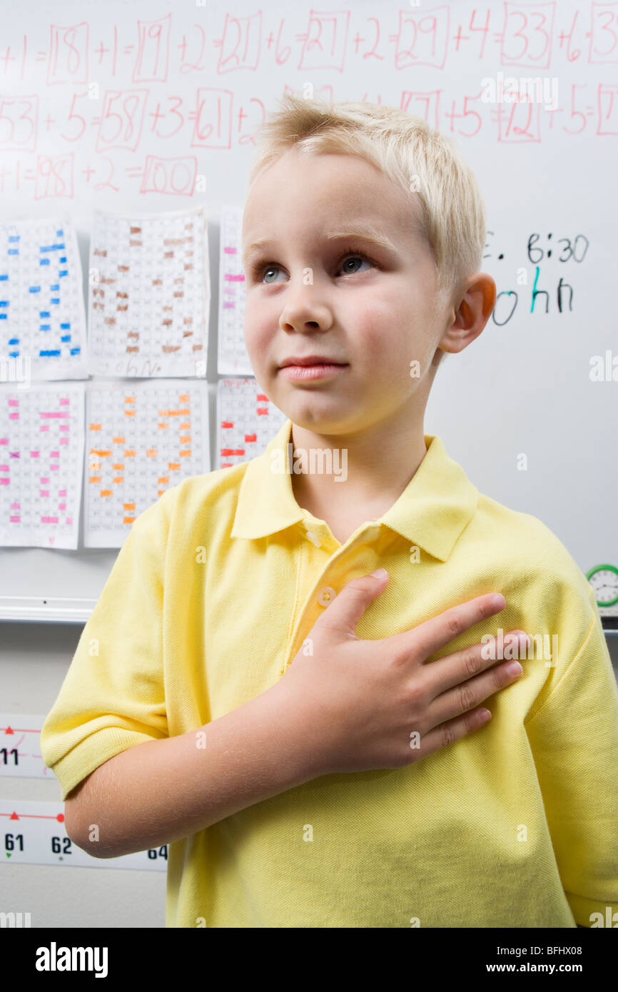 Schoolboy with His Hand over His Heart Stock Photo - Alamy