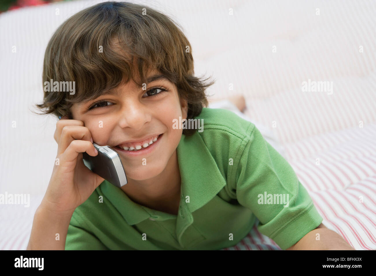 Young Boy Using Cell Phone Stock Photo - Alamy