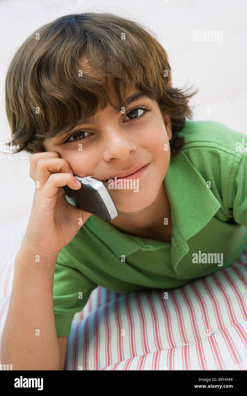 Young Boy Using Cell Phone Stock Photo - Alamy