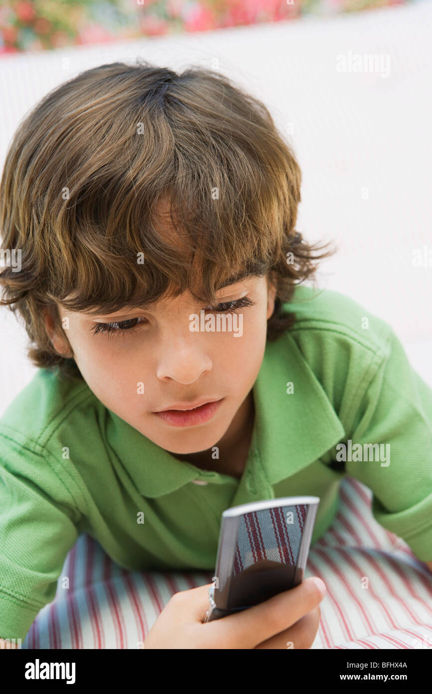 Young Boy Using Cell Phone Stock Photo - Alamy
