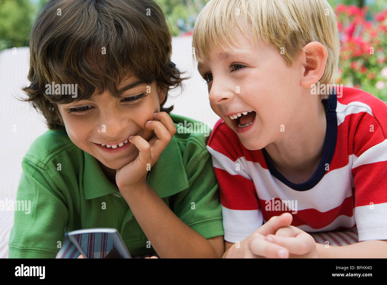Young Boys with Cell Phone Stock Photo - Alamy