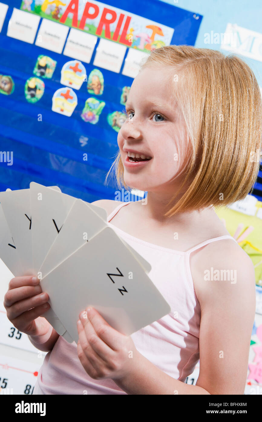 Elementary Student with Alphabet Flash Cards Stock Photo - Alamy