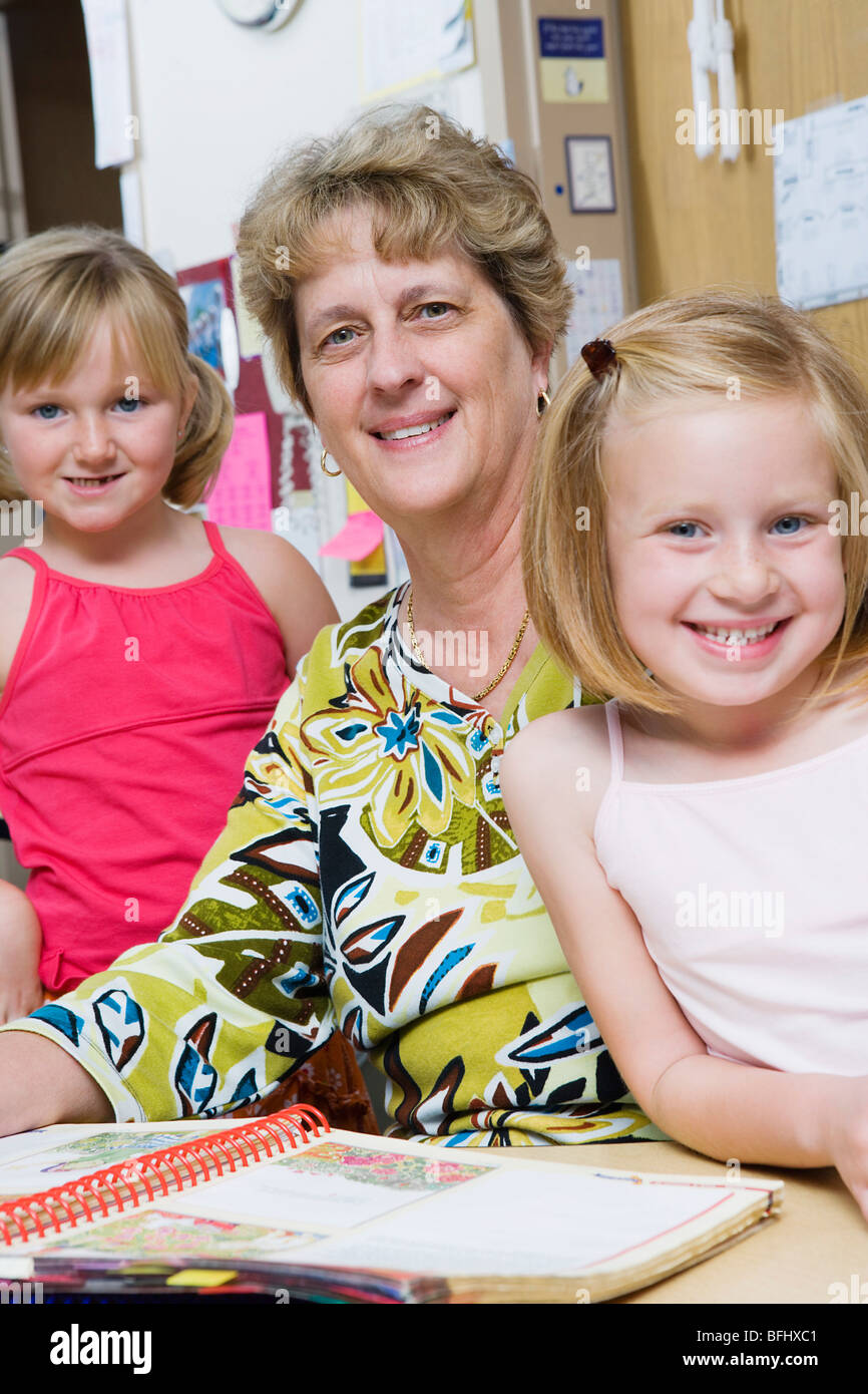 Teacher with Elementary Students Stock Photo - Alamy