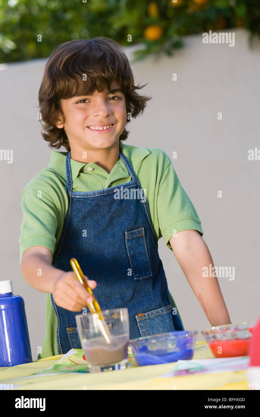 Child painting outdoors hi-res stock photography and images - Alamy