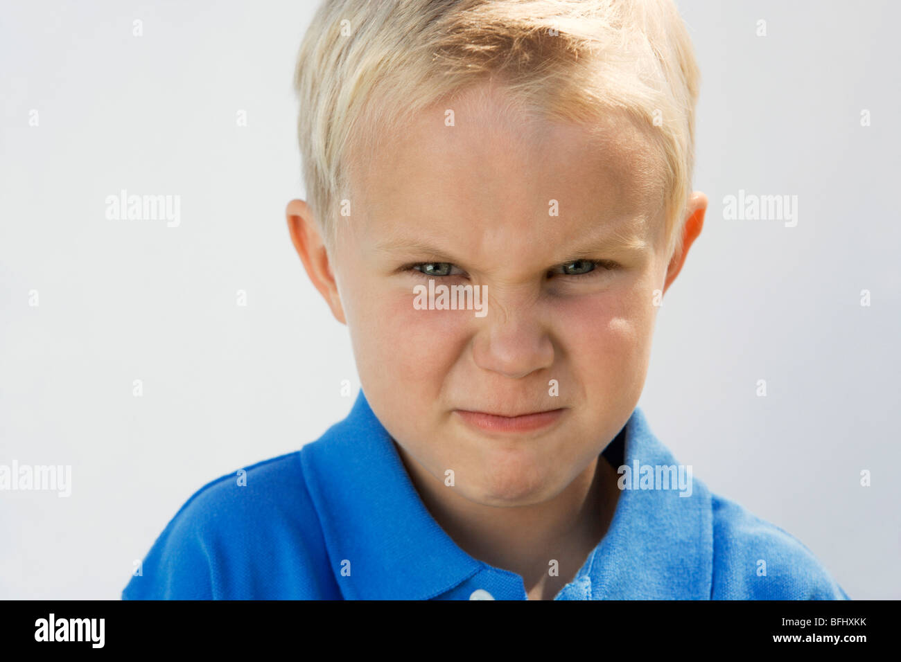 Young Boy Glaring Stock Photo - Alamy