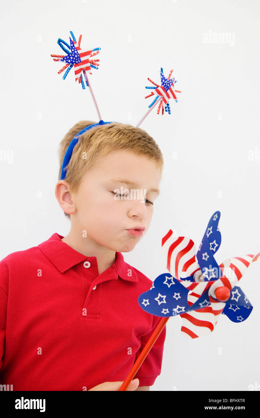 Boy Playing with Stars and Stripes Pinwheel Stock Photo - Alamy