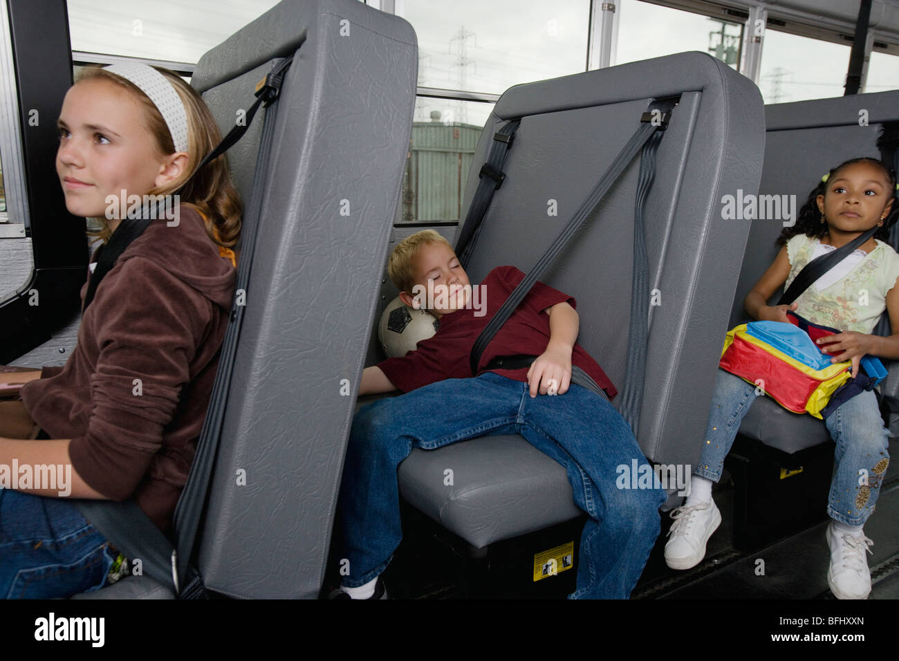 Elementary Students on School Bus Stock Photo - Alamy