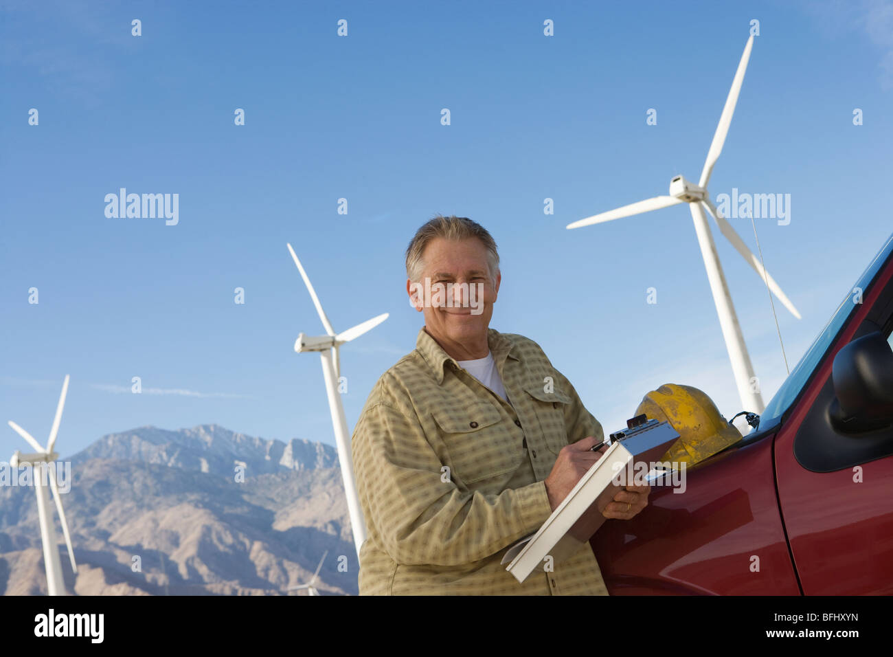 Senior man working at wind farm Stock Photo - Alamy