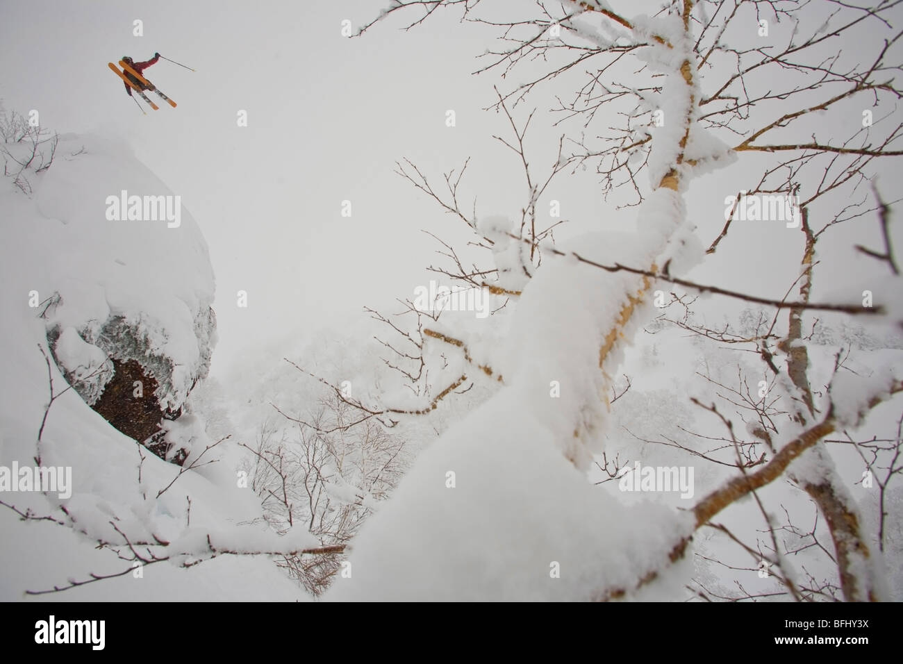 A skier in mid air after jumping a cliff in Furanodake backcountry ...