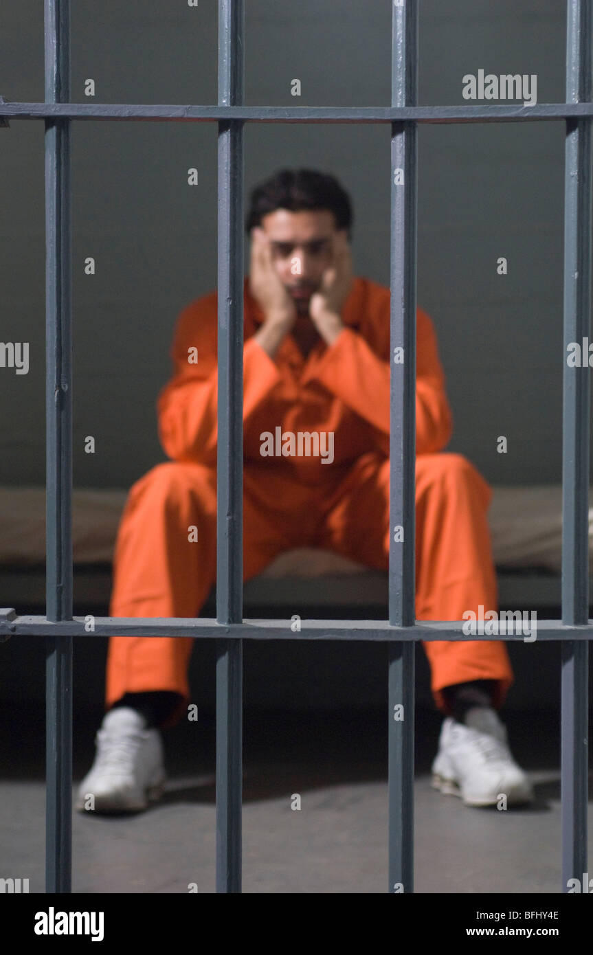 Prisoner in cell Stock Photo - Alamy