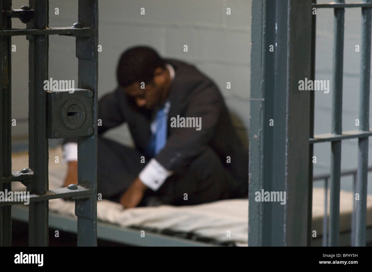 Sitting in prison cell hi-res stock photography and images - Alamy