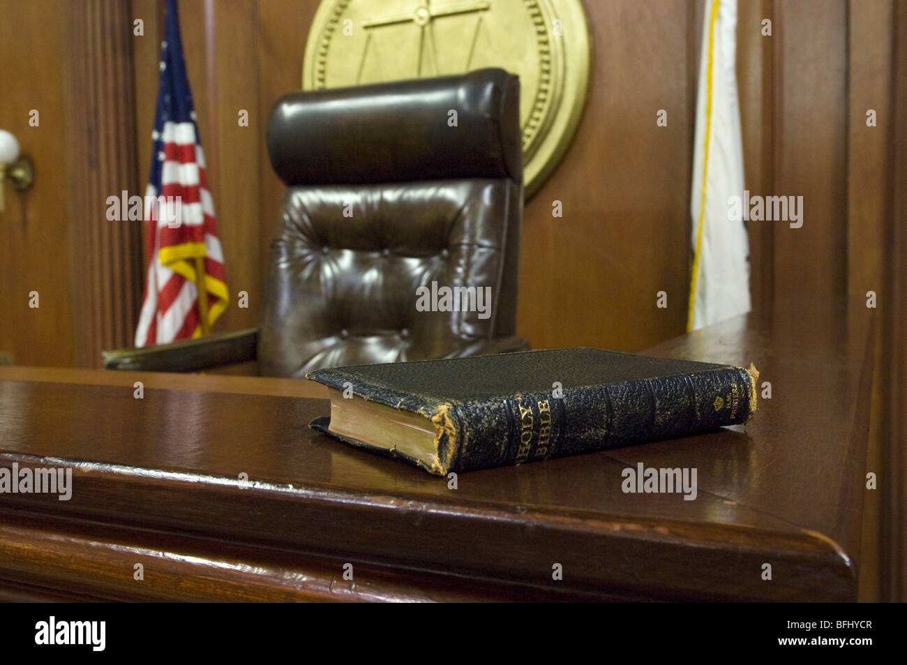 Bible beside judges chair in court Stock Photo - Alamy