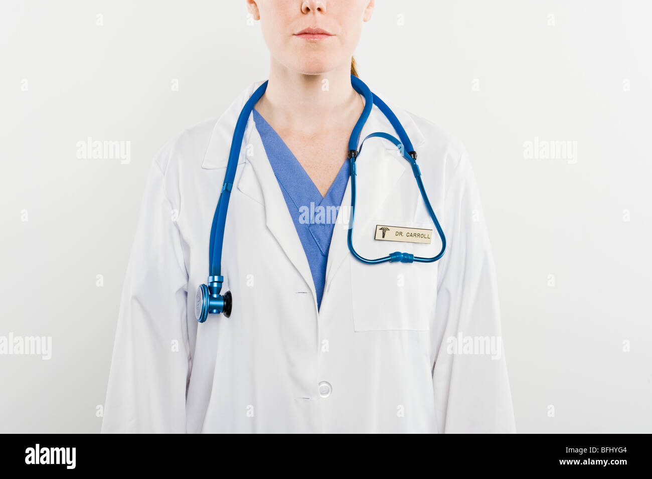 Doctor with stethoscope, mid section Stock Photo - Alamy