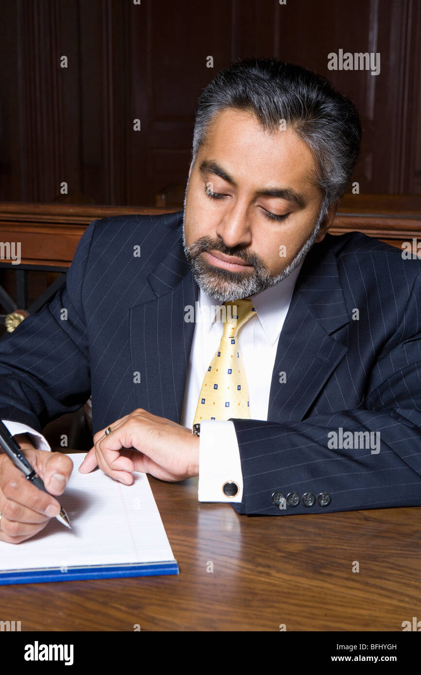 Man writing in court Stock Photo - Alamy