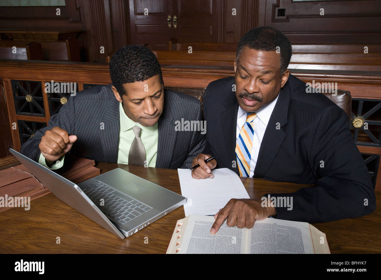 Two men working in court Stock Photo - Alamy