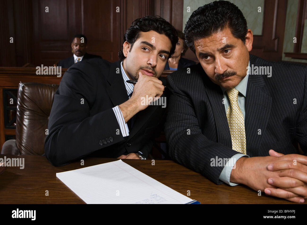 Two men sitting in court Stock Photo - Alamy