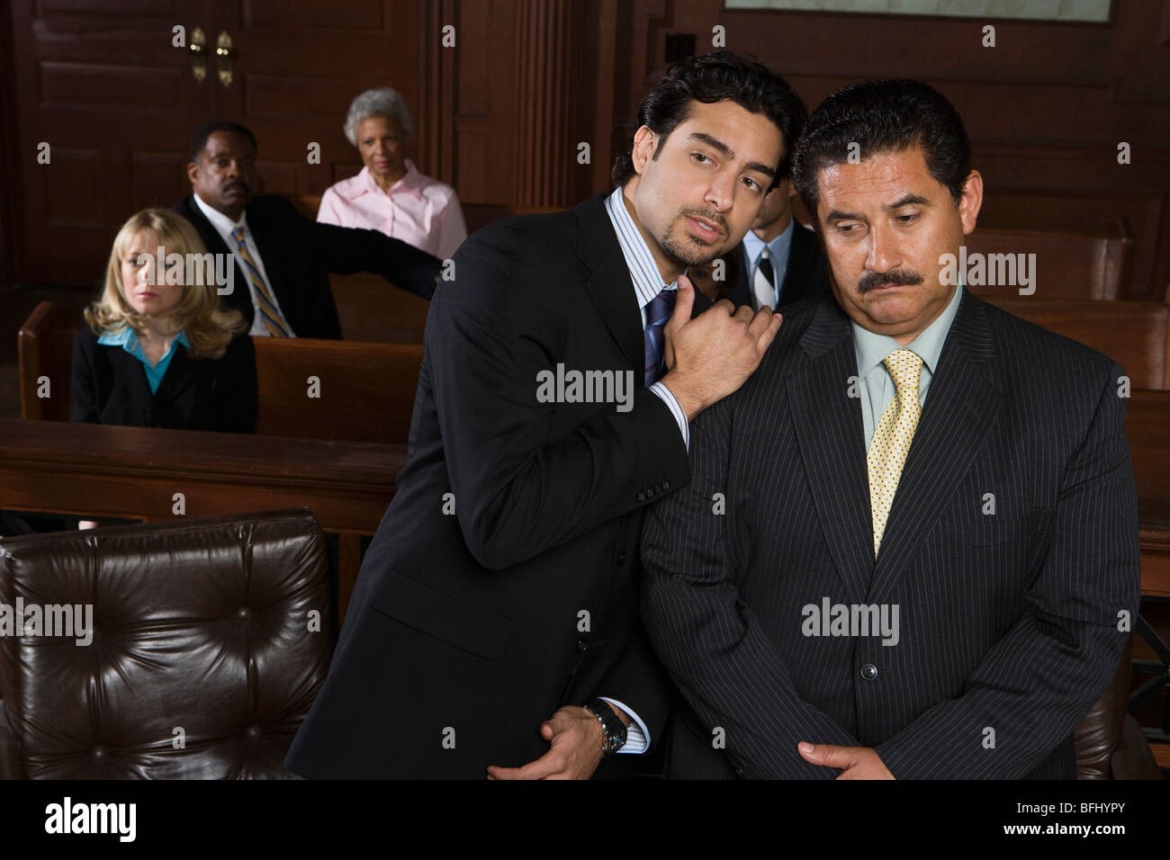 Two men sitting in court Stock Photo - Alamy