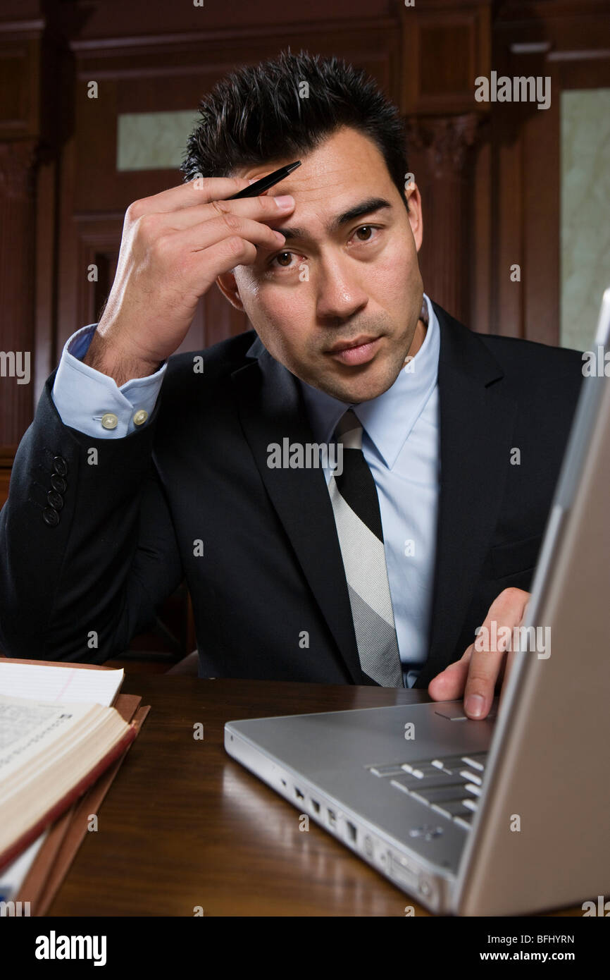 Man using laptop in court, portrait Stock Photo - Alamy