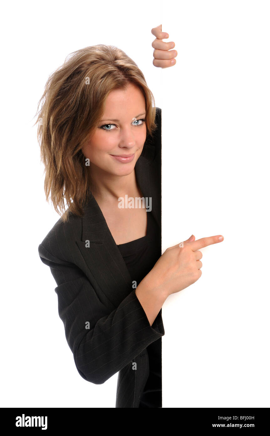 Businesswoman pointing to blank sign isolated over white background ...