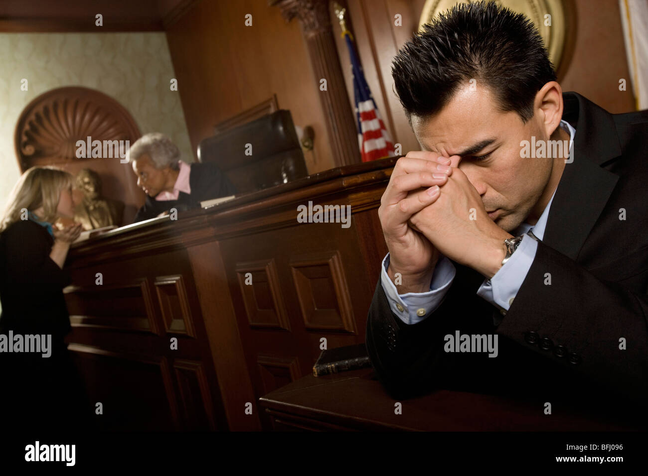 Guilty man in court room Stock Photo - Alamy