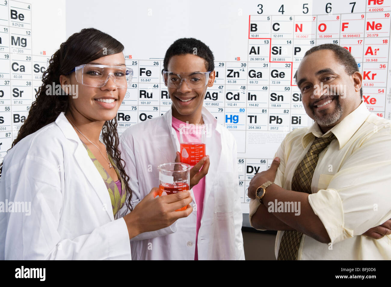 Science Students with Beakers Stock Photo - Alamy