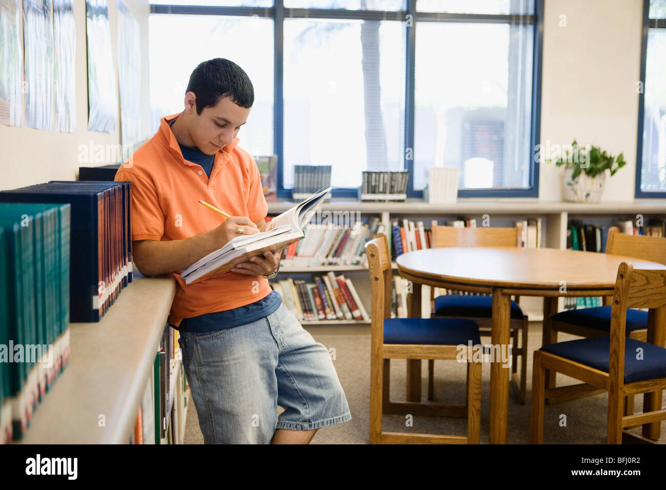 High School Student Studying in Library Stock Photo - Alamy