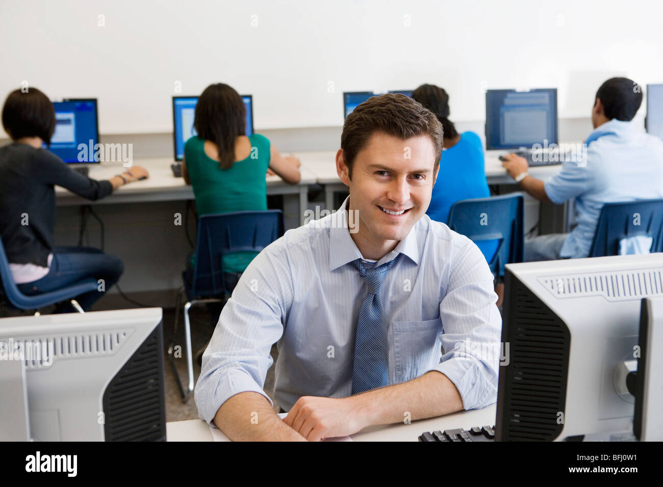 High School Teacher in Computer Lab Stock Photo - Alamy