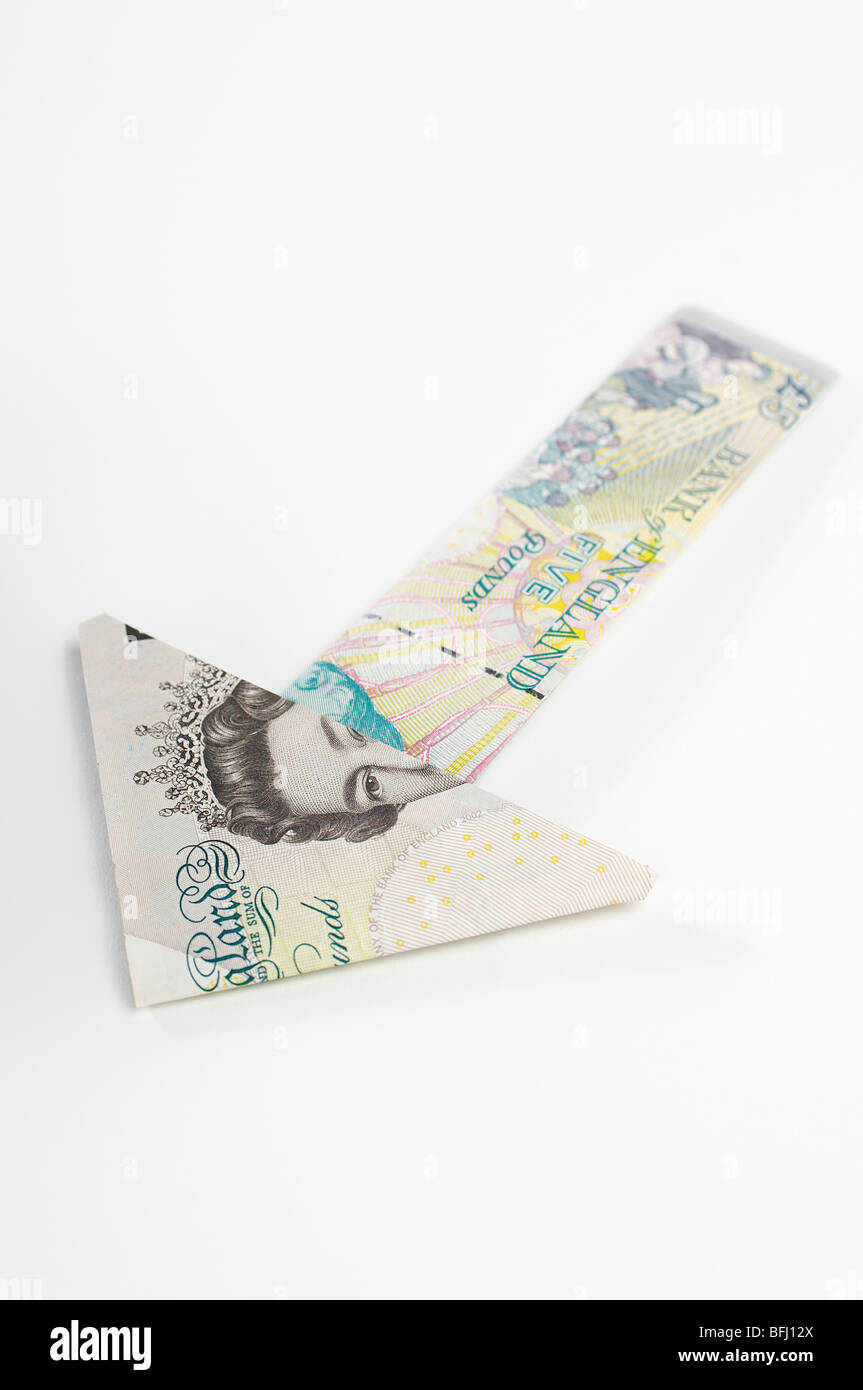 Arrow made of folded banknotes Stock Photo - Alamy