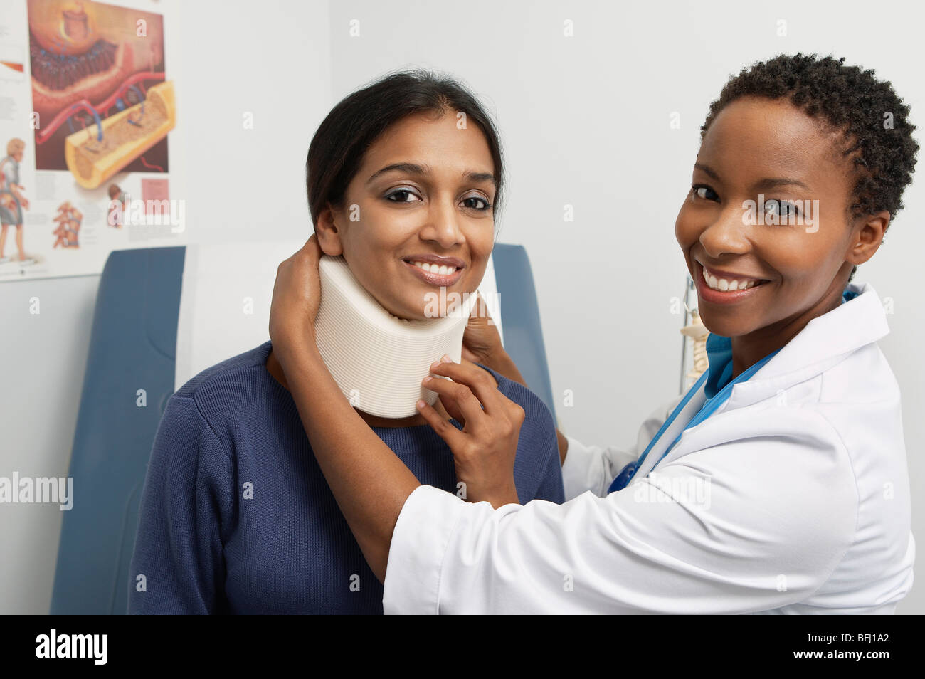Female doctor puting brace on patient's neck Stock Photo - Alamy