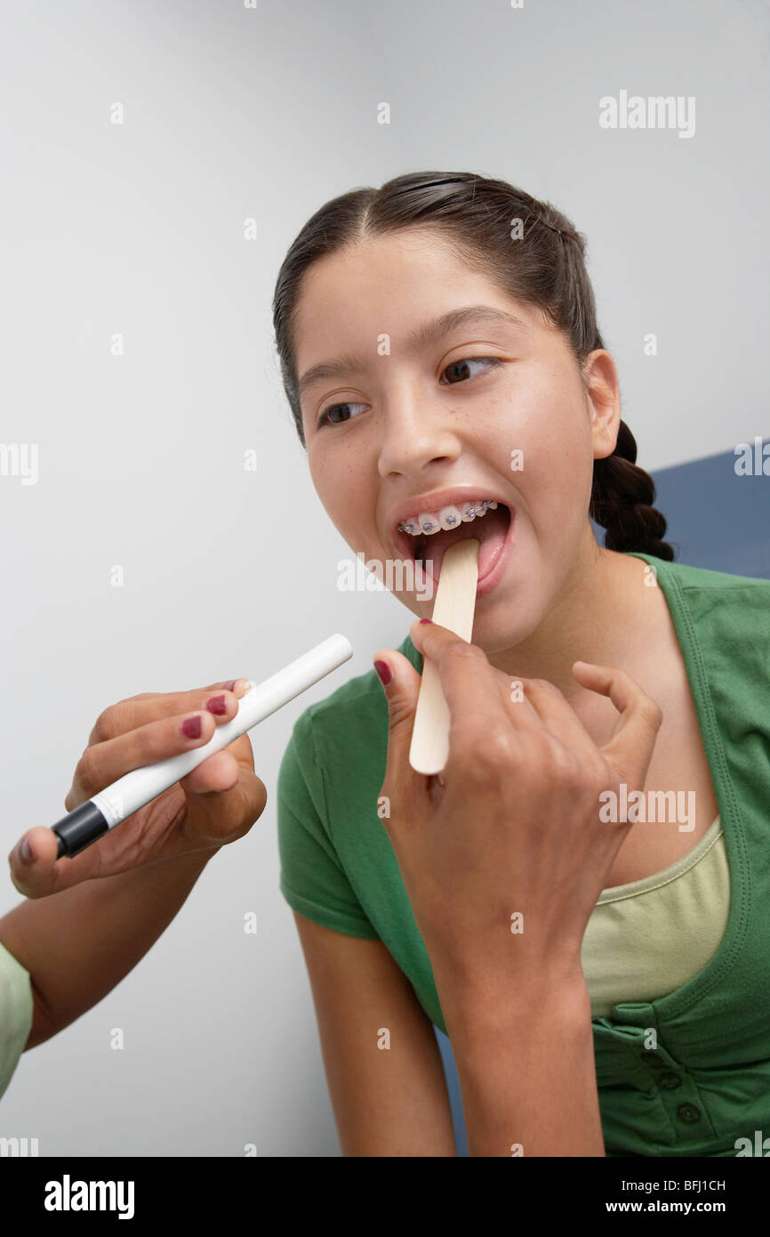 Girl having medical examination Stock Photo - Alamy