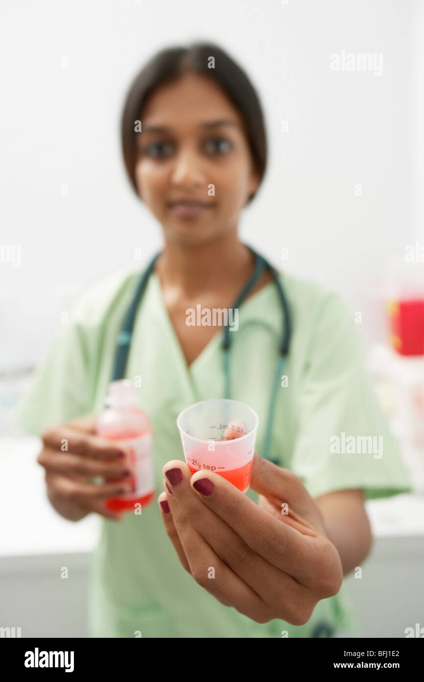 Doctor giving medicine Stock Photo - Alamy