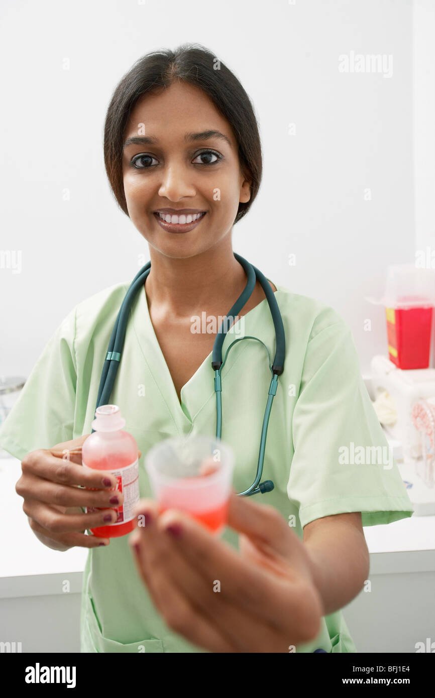 Doctor giving medicine Stock Photo - Alamy