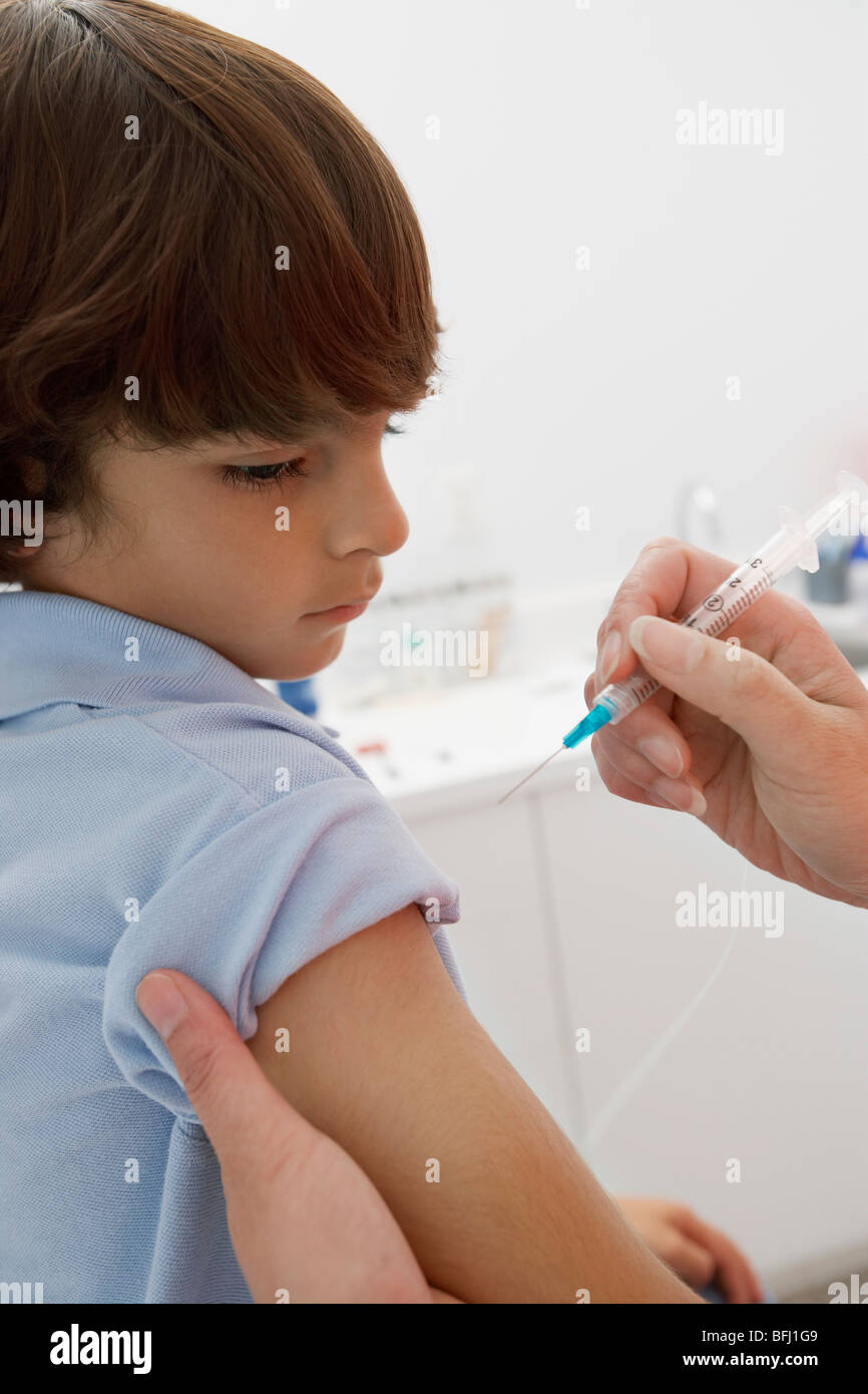 Boy receiving injection,close-up Stock Photo - Alamy